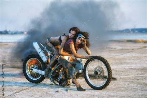 Beautiful Sexy Girl Pose In Front Of A Disassembled Motorcycle Stock