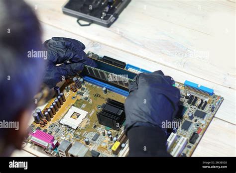 Inserting Ram Into Motherboard From Computer On Table And Gray Background Stock Photo Alamy