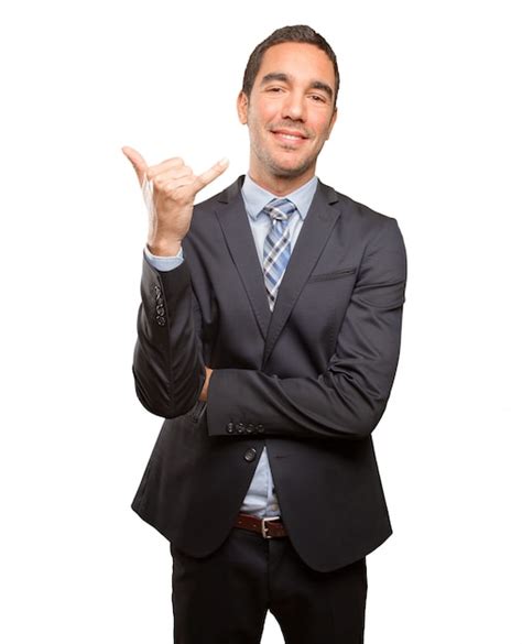 Premium Photo Confident Young Businessman Doing A Call Gesture