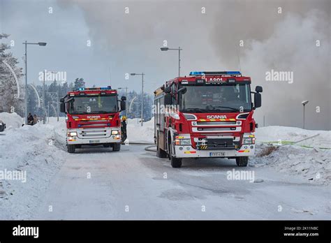 Fire Trucks For Emergency Response At A Burning Building In Finland
