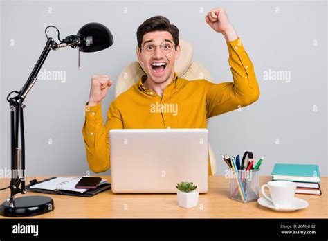 Portrait Of Attractive Cheerful Man Programmer Having Fun Rejoicing Isolated Over Grey Color