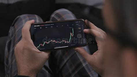 trader using technical analysis at stock market candlestick patterns analyzing market trends