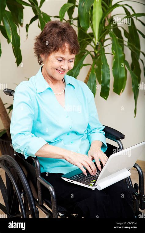 Disabled Businesswoman Using A Tiny Netbook Computer Stock Photo Alamy
