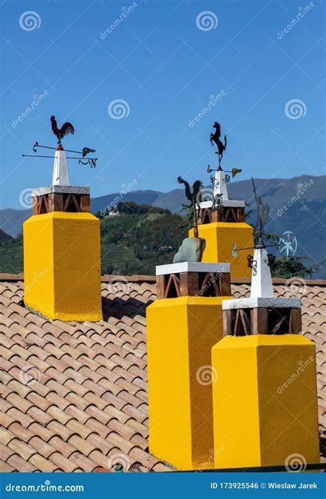 Yellow Chimneys Decorated With Artistic Metalwork At Strada Del