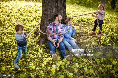 Girls Tying Boy To Tree Imagens E Fotografias De Stock Getty Images