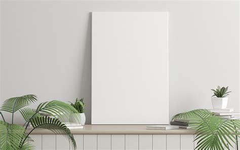 그림 캔버스 프레임의 목 업 꽃병에 작은 식물과 흰 벽에 책 현대적인 인테리어 디자인의 관점 3d 렌더링 액자에 대한 스톡 사진 및 기타 이미지 Istock