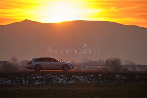 Car Driving Fast On Intercity Road At Sunset Highway Traffic In