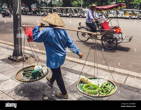 Traditional Scene At Street In Hanoi Vietnam Street Food Seller And