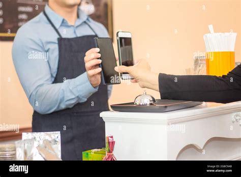 People Using Smartphone Mobile Banking Scan QR Code To Pay In Shop Stock Photo Alamy