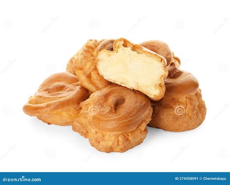 Cut And Whole Delicious Profiteroles With Cream Filling On White
