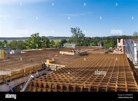 Reinforcing Steel Mesh On Building Site In Green Scenery On Blue Sky
