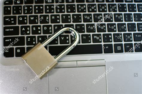 Cyber Safety Concept Locked And Key On Laptop Computer Keyboard Key To Unlock Before Green