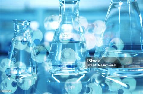 Three Glass Flasks With Chemical Molecular Structure In Blue Science