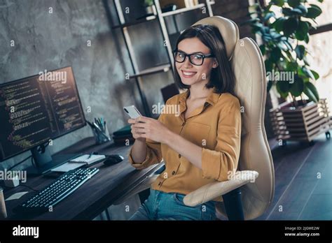 Portrait Of Beautiful Cheerful Skilled Girl Using Gadget App Developing