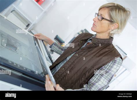 Woman Using Printer On Table Stock Photo Alamy
