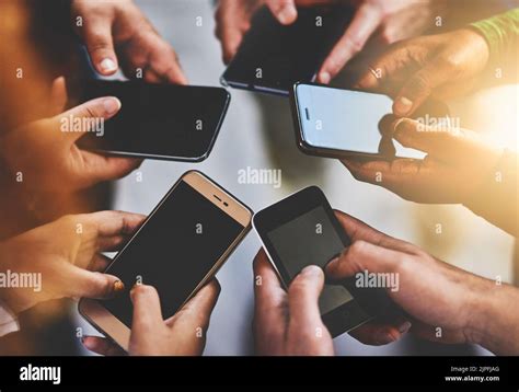 Always On Always Connected A Group Of People Using Their Phones