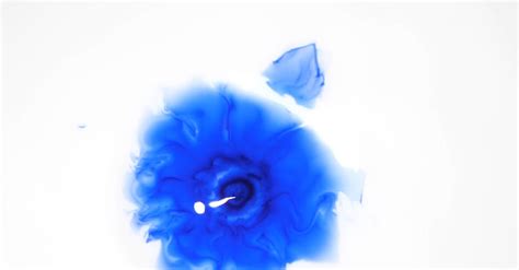 Blue Droplets Of Dye On A Liquid Producing Artistic Design · Free Stock