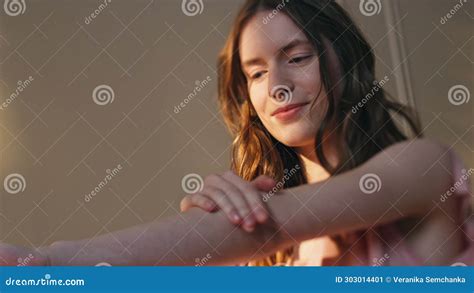 Closeup Girl Applying Lotion On Smooth Skin In Sunlight Serene Woman
