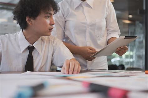 Premium Photo Man And Woman Working On Table