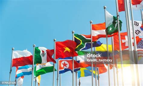 Set Of Flags Fluttering In The Wind Against Blue Sky Background Stock