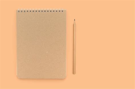 Premium Photo Beige Working Notebook And Pencil For Notes On A Beige