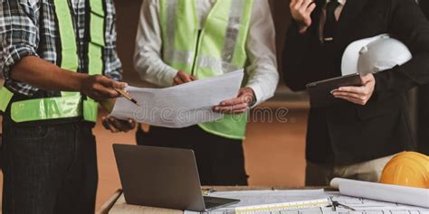 Architect Team Working With Blueprints For Architectural Plan Engineer Sketching A Construction