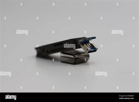 A Close Up Of Multifunction USB OTG Adapter Type A To Type C And Micro USB Type Which Is Gray