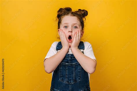 Surprised Little Preschool Girl Look At Camera Feel Stunned Amazed By
