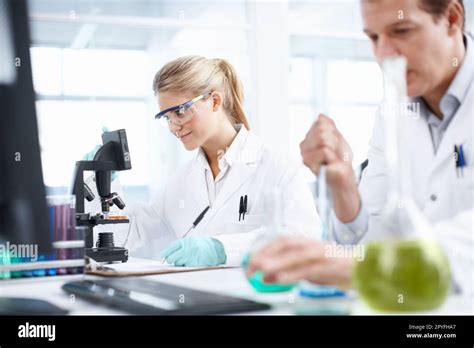 Analyzing Samples Two Researchers Hard At Work In The Laboratory Stock