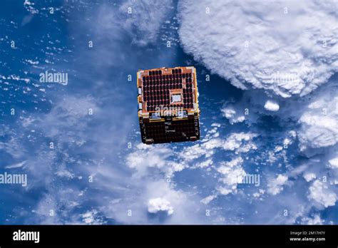 Small Satellite Orbiting Outer Space Above Earth Deployed By The