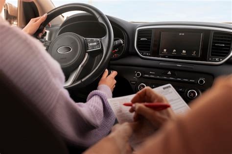 free photo woman taking her driver s license test in vehicle