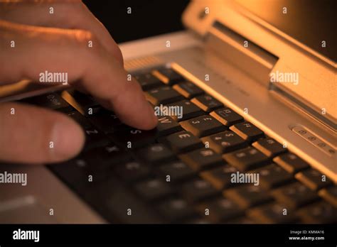 Man Pressing A Key On A Laptop Keyboard Stock Photo Alamy