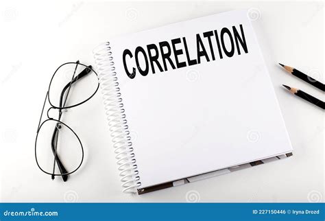 Text Correlation Coefficient On Office Desk Table With Keyboard