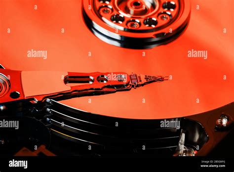 The Hard Disk From The Computer HDD Is Red With A Mirror Effect The Hard Drive From The