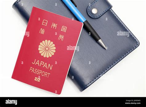 Japanese Passport And Leather Notebook Isolated On White Background