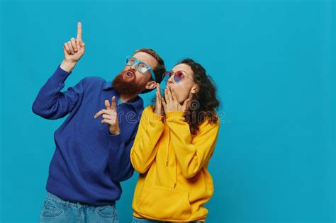 A Woman And A Man Fun Couple Cranking And Showing Signs With Their