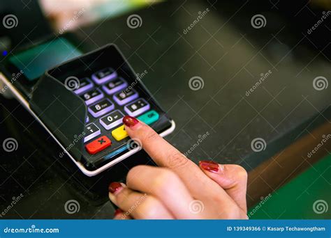 Finger Of Women Inserting Password Or Pin Code On Machine Keypad Of Payment Terminal Stock Photo