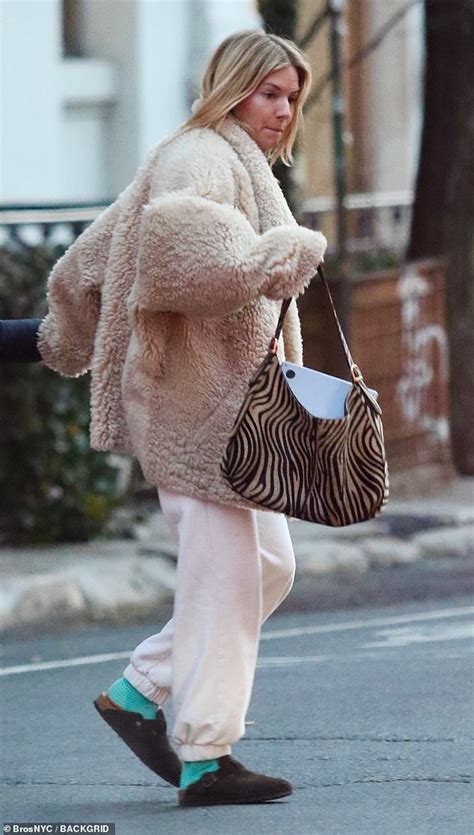 Sienna Miller Cuts A Stylish Figure In A Cosy Fur Jacket As She Exits A