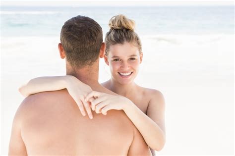 Premium Photo Couple Hugging On The Beach