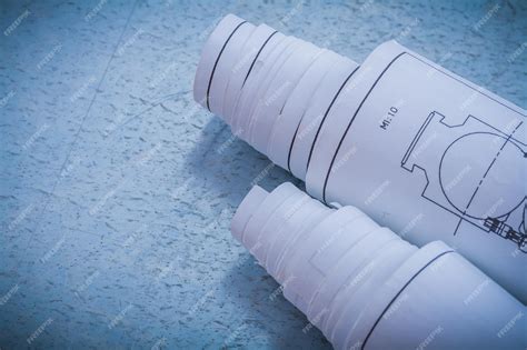 Premium Photo Metallic Background With Pair Of Rolled Blueprints Building And Architecture Concept