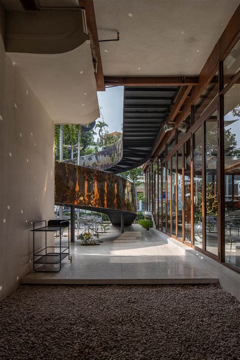 The Lab Saigon Adds An Expressive Looping Staircase To Courtyard Of