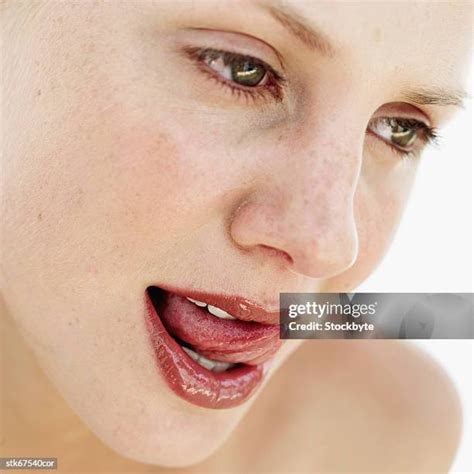Young Woman Licking Lips Close Up Of Mouth Photos And Premium High Res