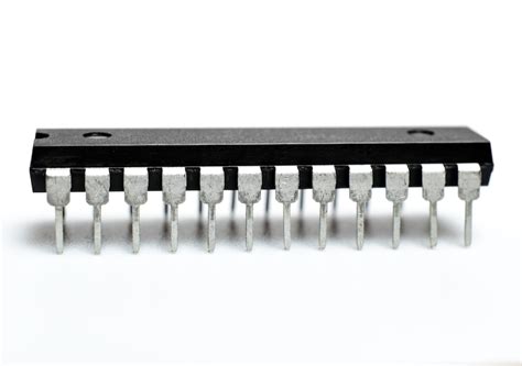 Premium Photo Black Microchip With Metal Legs On A White Background