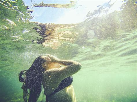 Premium Photo Close Up Of Sunlight Falling On Woman Swimming