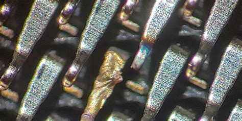 Fried CPU Socket Under A Low Power Microscope Images