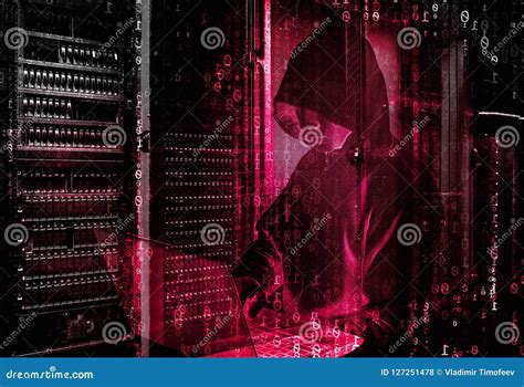 Internet Crime Concept Male Figure With Hood On Red Wall Background Hacker Concept Stock