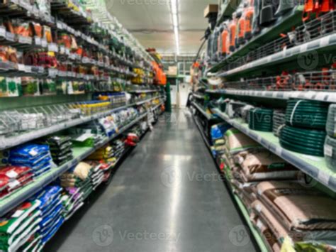 A Blurry Image Of A Hardware Store With Paints Varnish Brushes In A