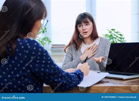 Sad Serious Teenage Girl At Session In Office Of Mental Professional