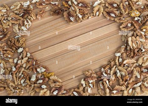 Fresh Walnut Kernels On Wooden Background With Copy Space In A Form Of