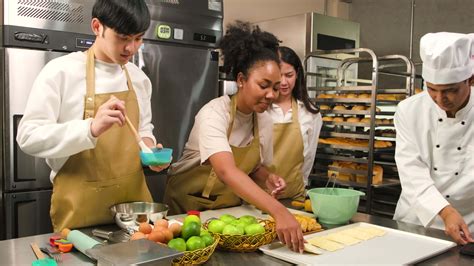 Cuisine Course A Senior Male Chef In Cook Uniform Teaches Young